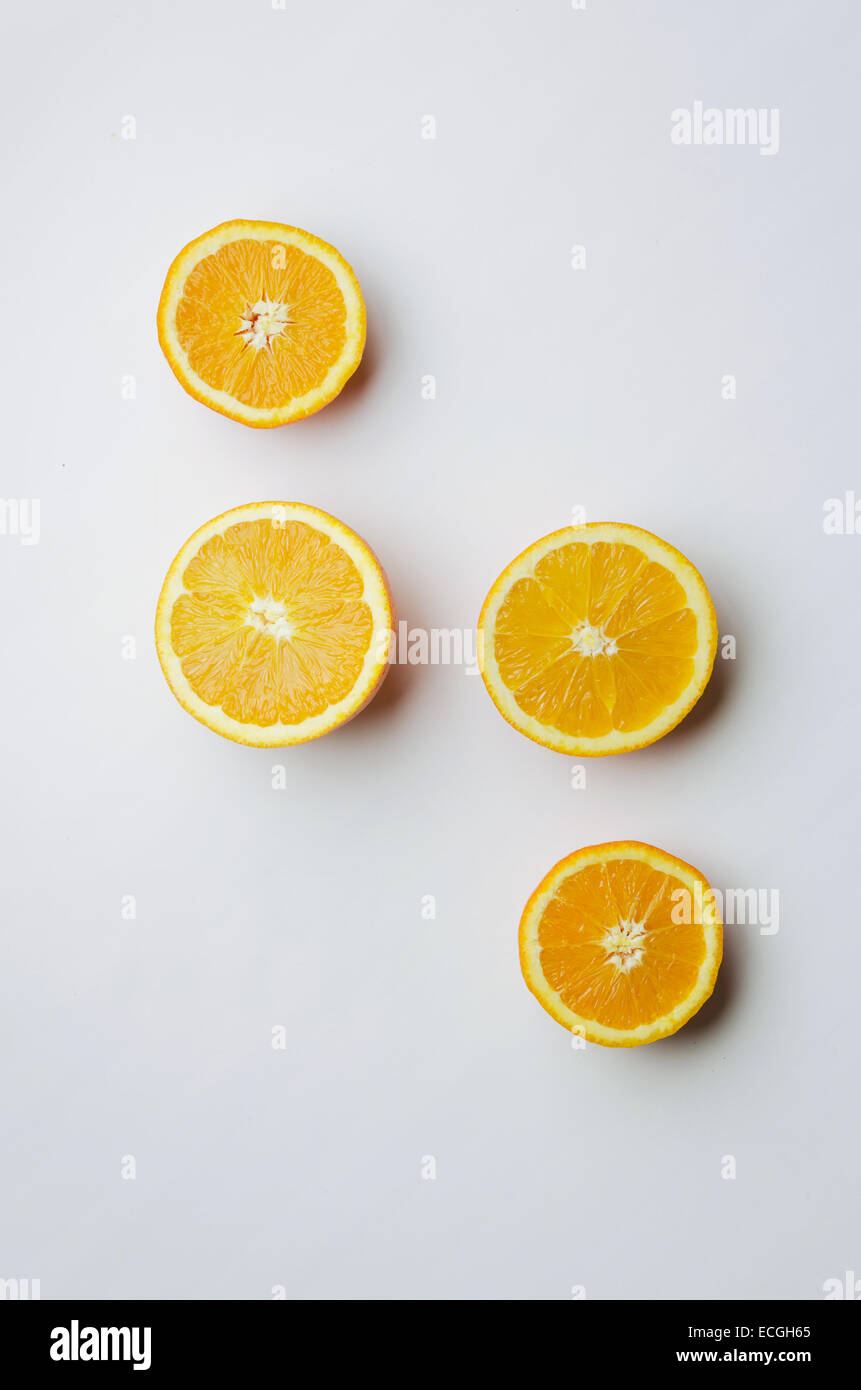 Orange fruits over white table, above view Stock Photo - Alamy