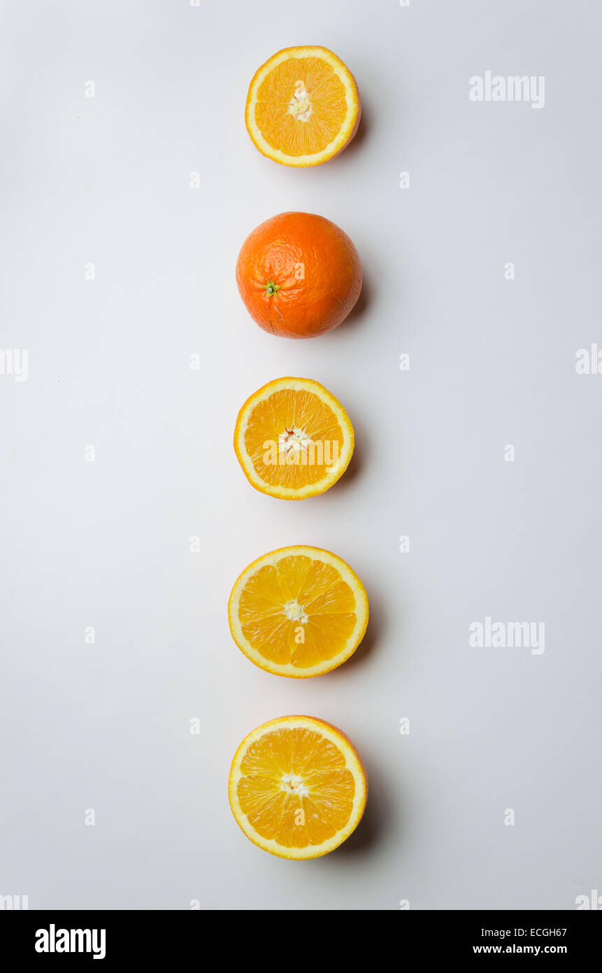 Orange fruits over white table, above view Stock Photo - Alamy