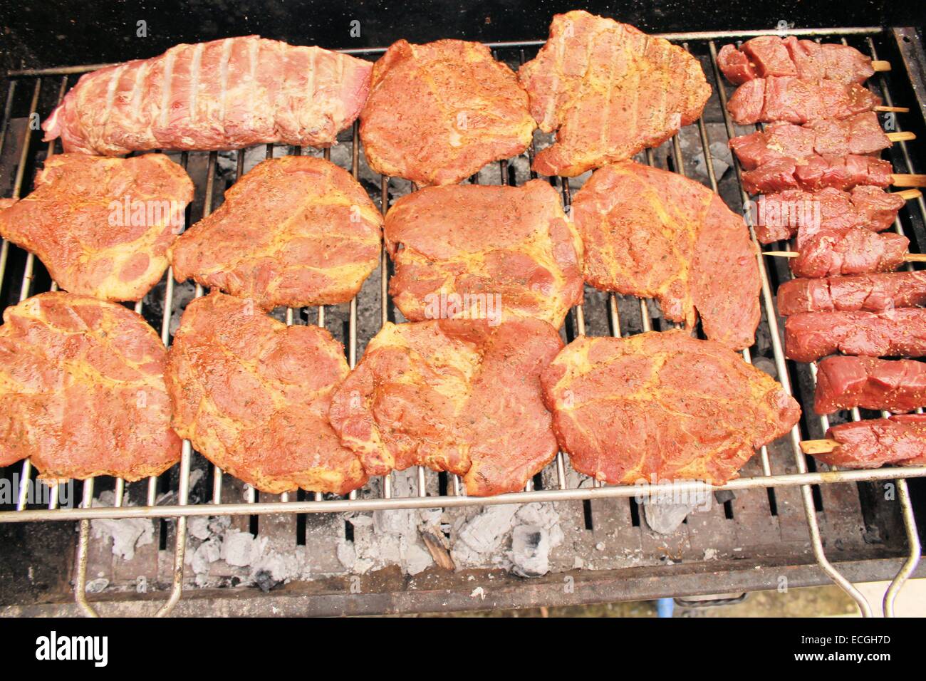 mixed meat on an outdoor grill Stock Photo - Alamy