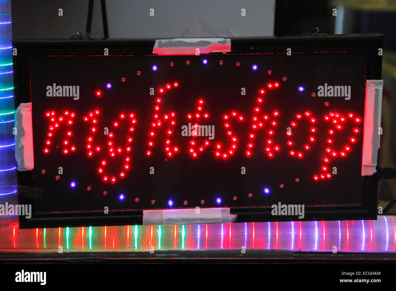 Night Shop. Red light Led signboard Stock Photo - Alamy