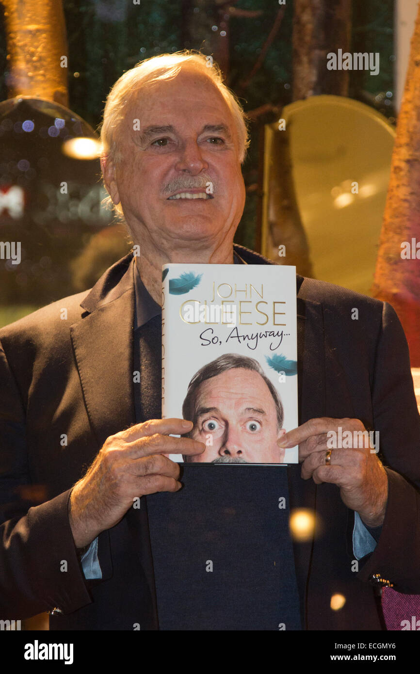 London, UK. 11 December 2014. John Cleese stands in a shop window of ...