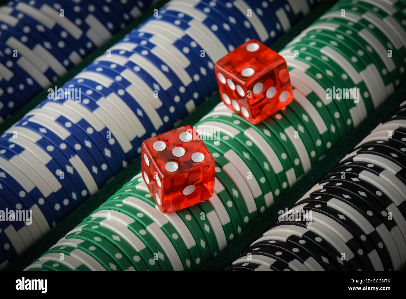 Gambling Chips and Red Dice Stock Photo - Alamy