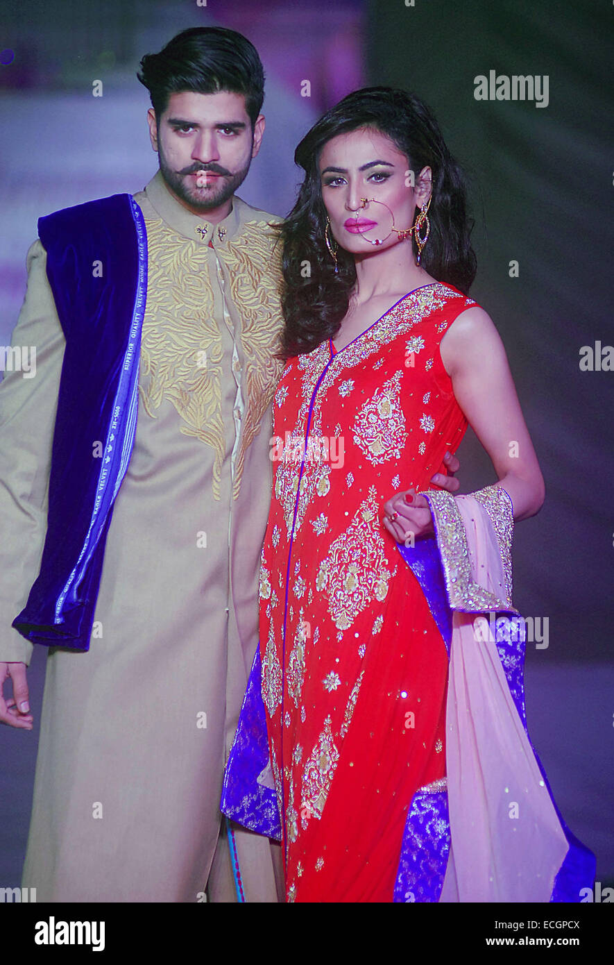 Islamabad, Pakistan. 14th Dec, 2014. Models present creations by ...
