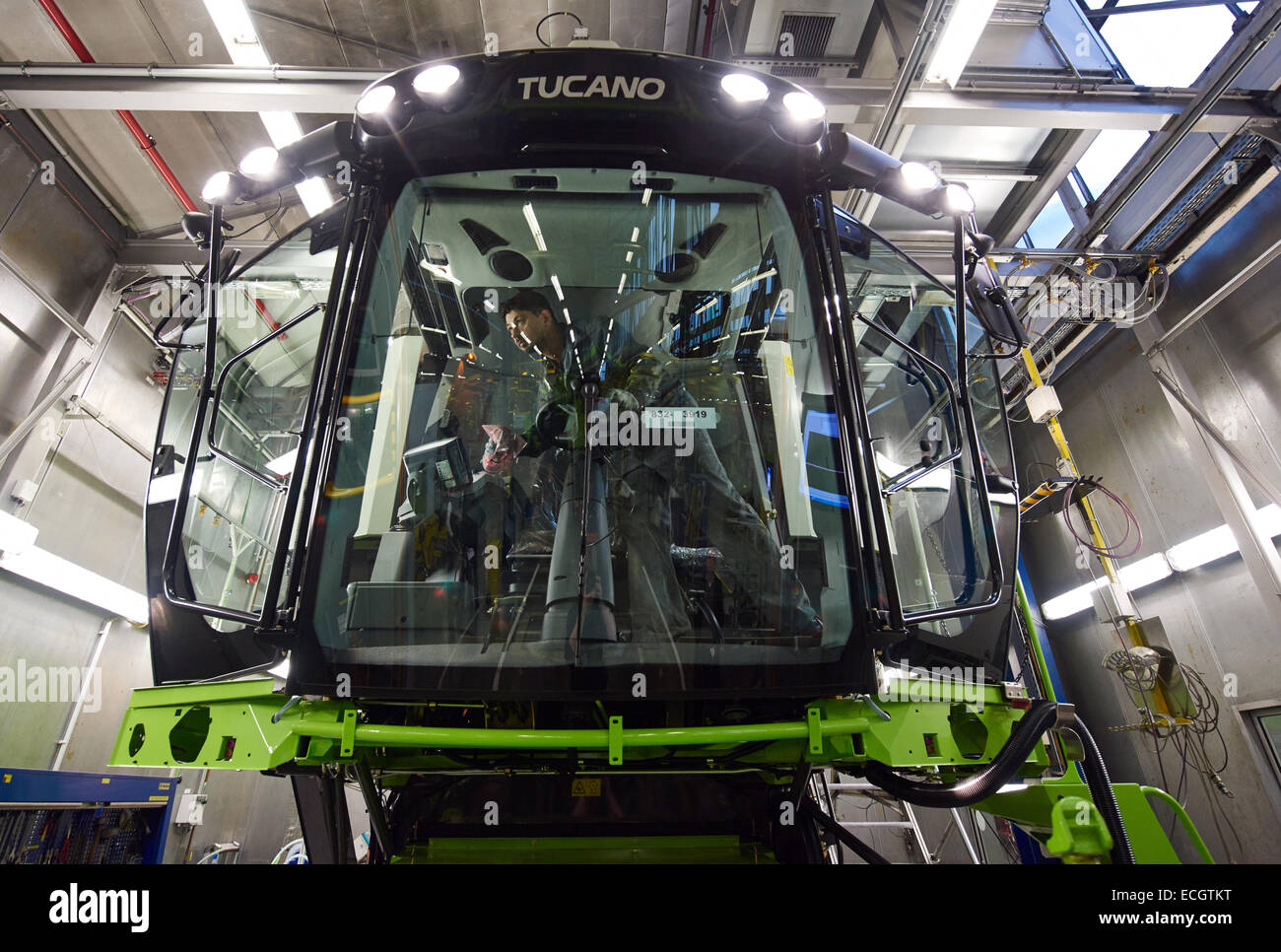 Harsewinkel, Germany. 12th Dec, 2014. An employee tests a Tucano ...