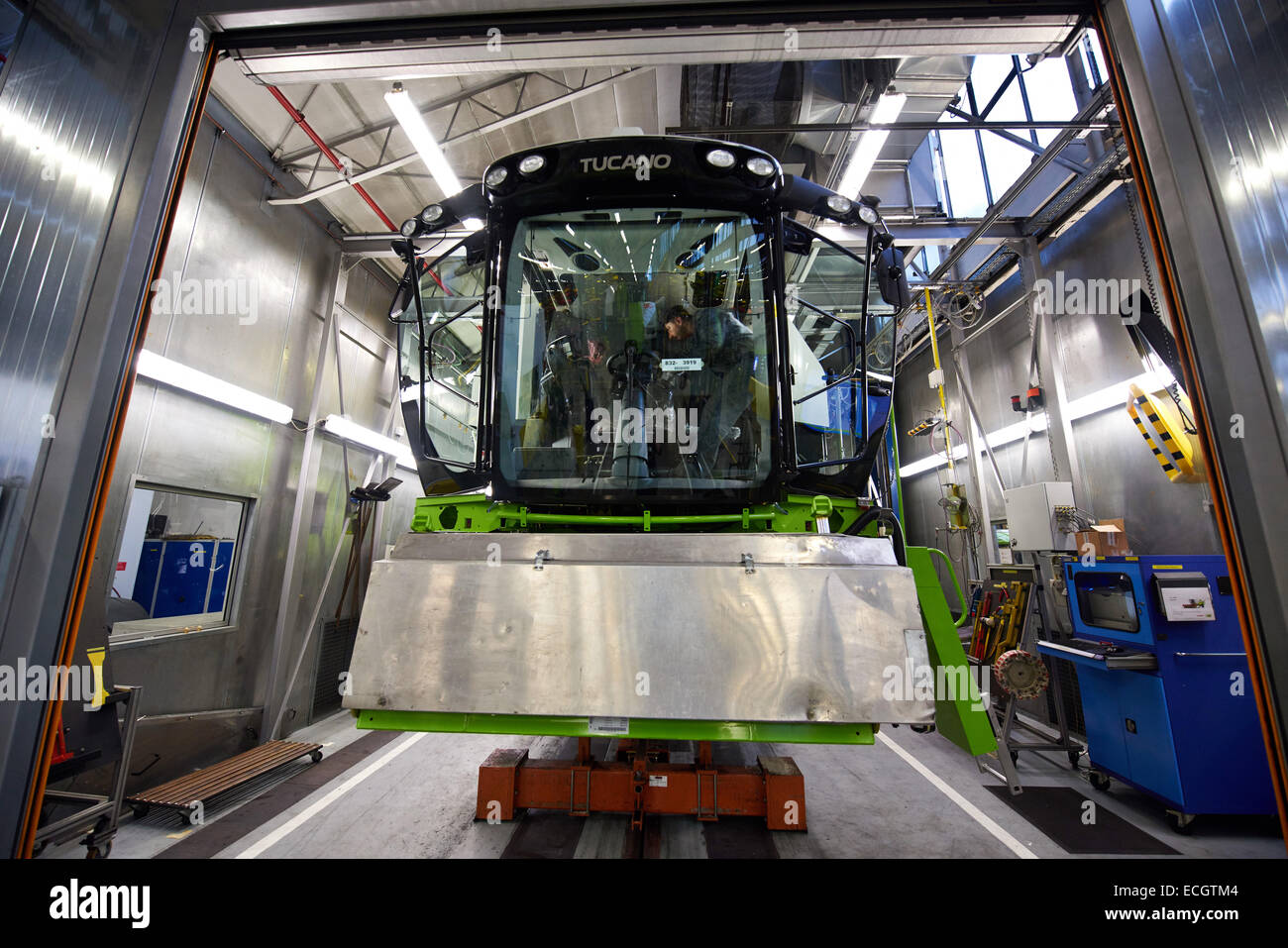 Harsewinkel, Germany. 12th Dec, 2014. An employee tests a Tucano ...