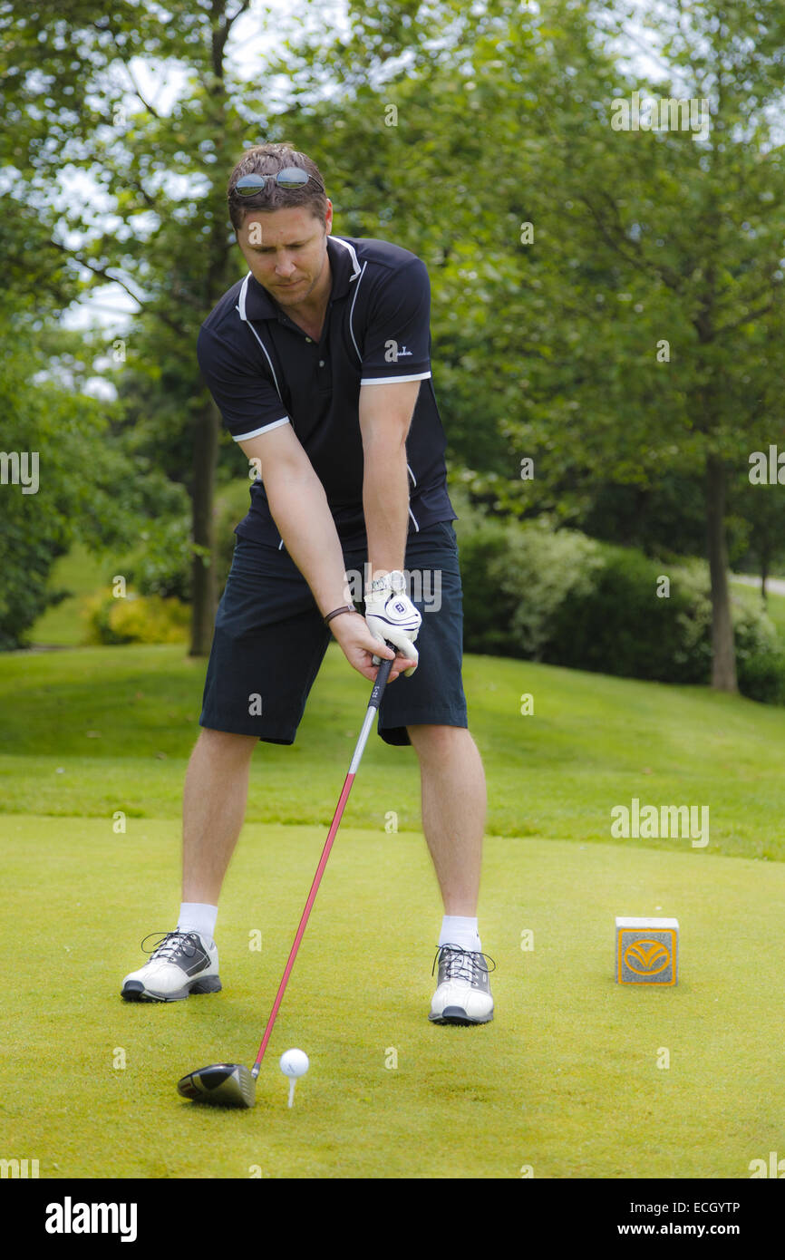 man playing golf Stock Photo - Alamy