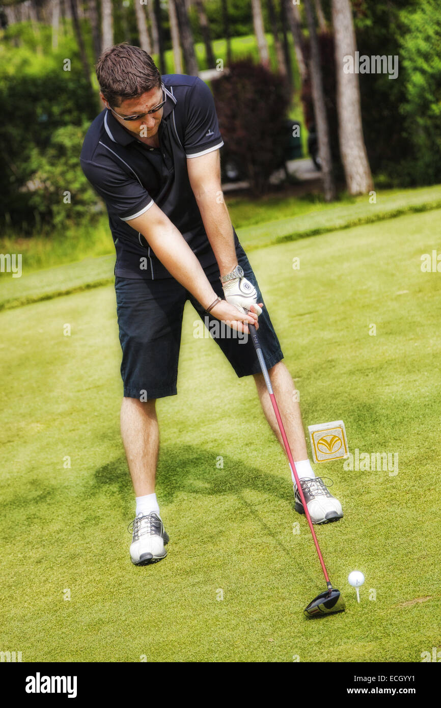 man playing golf Stock Photo - Alamy