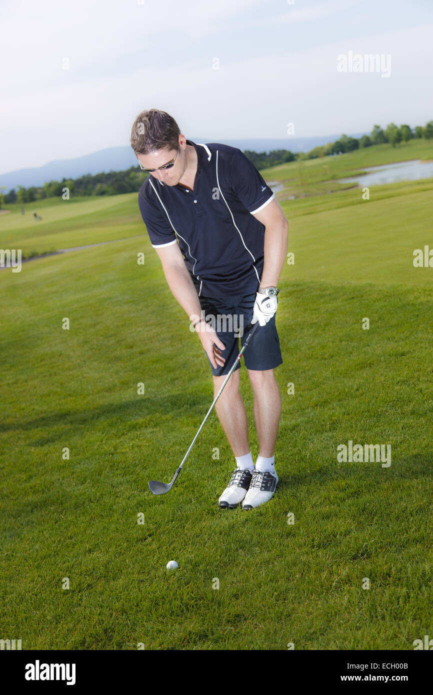 man playing golf Stock Photo - Alamy