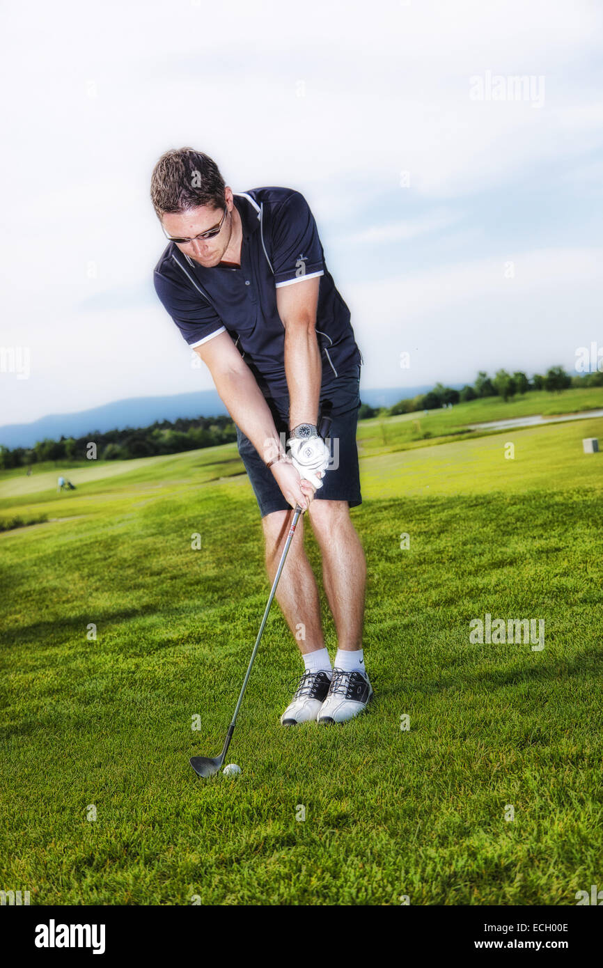 man playing golf Stock Photo - Alamy