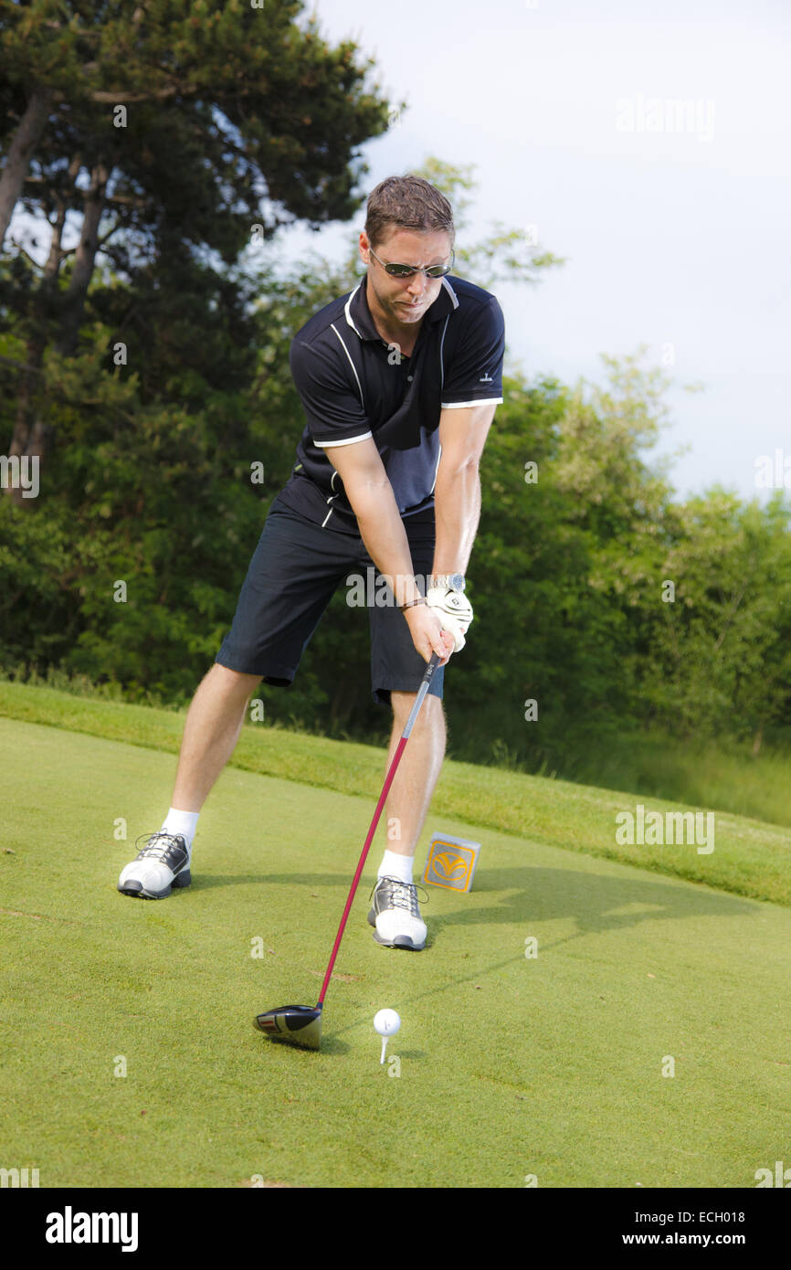 man playing golf Stock Photo - Alamy