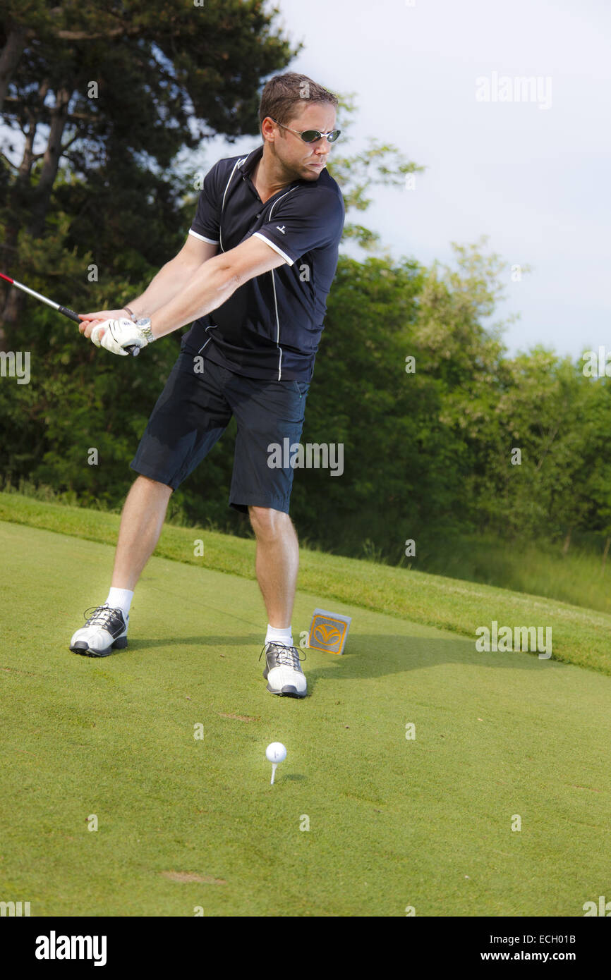 man playing golf Stock Photo - Alamy