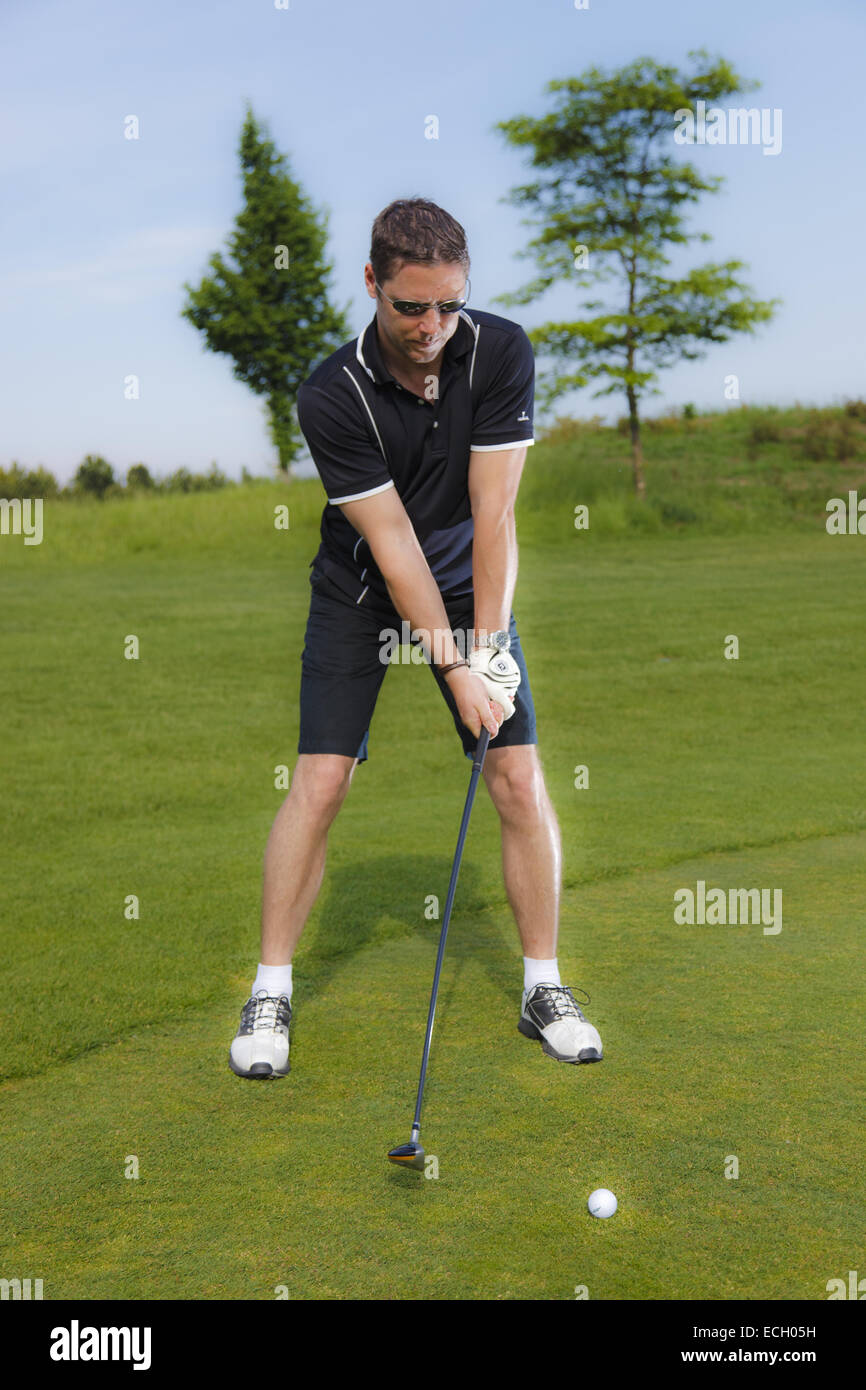 man playing golf Stock Photo - Alamy