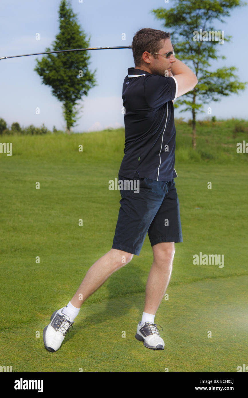 man playing golf Stock Photo - Alamy