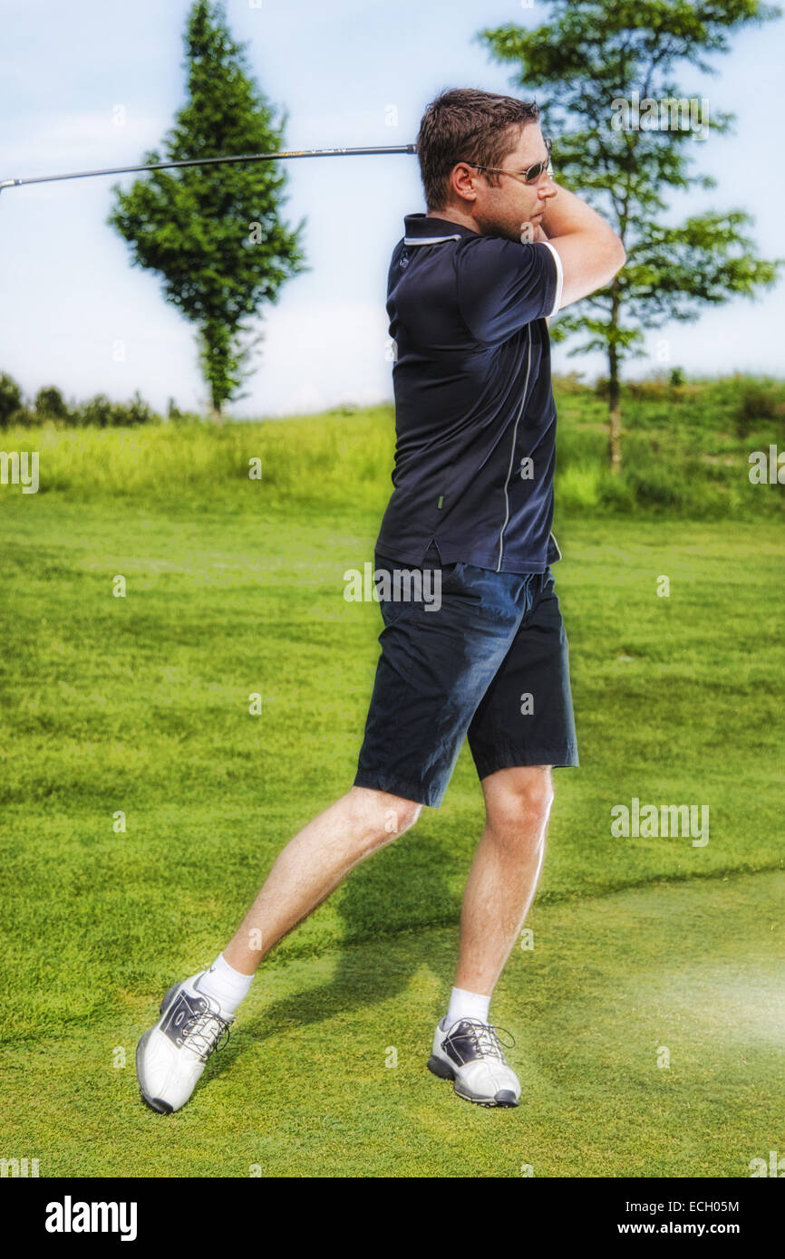 man playing golf Stock Photo - Alamy