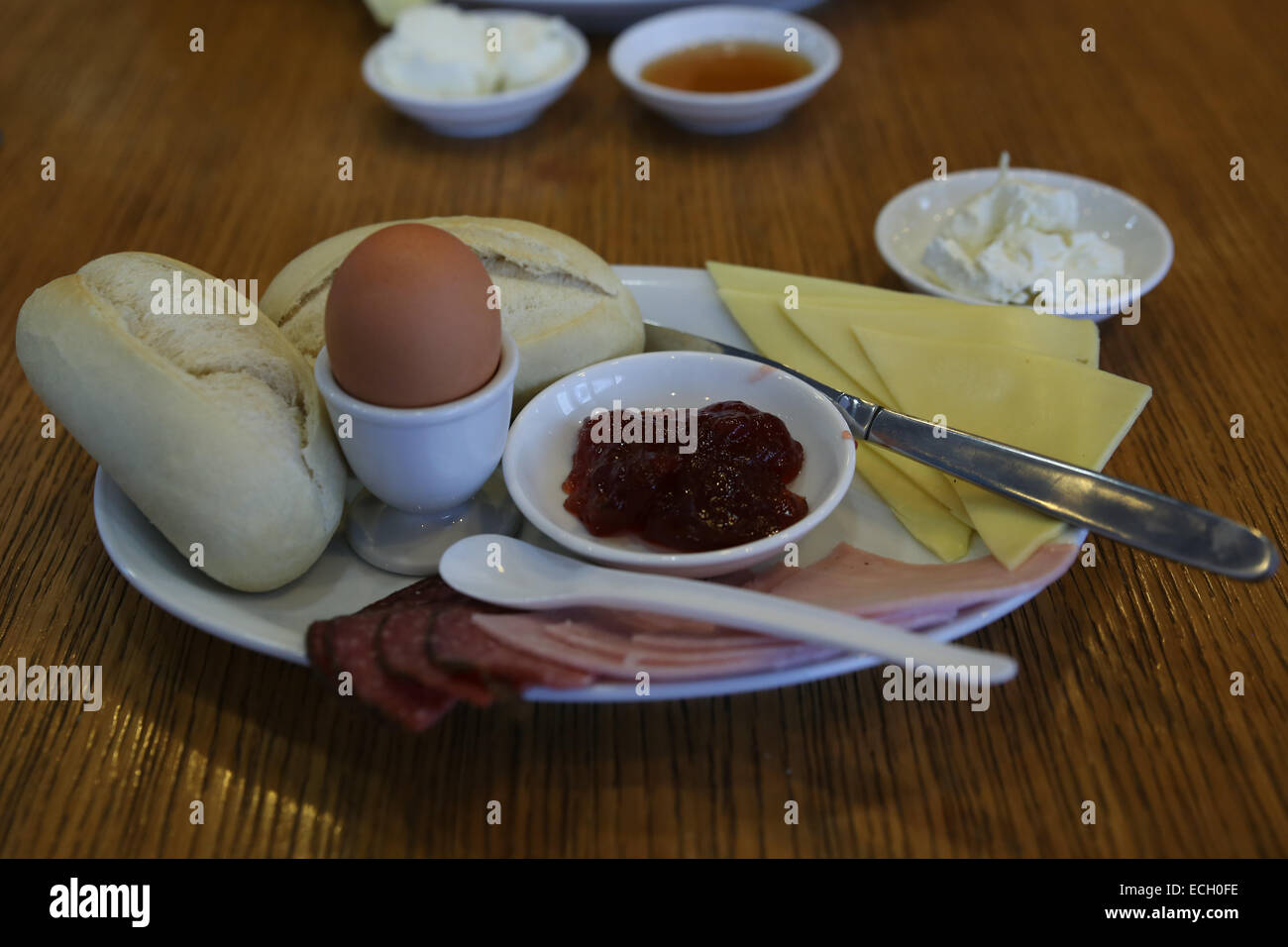 german breakfast egg ham cheese bread roll jam Stock Photo - Alamy