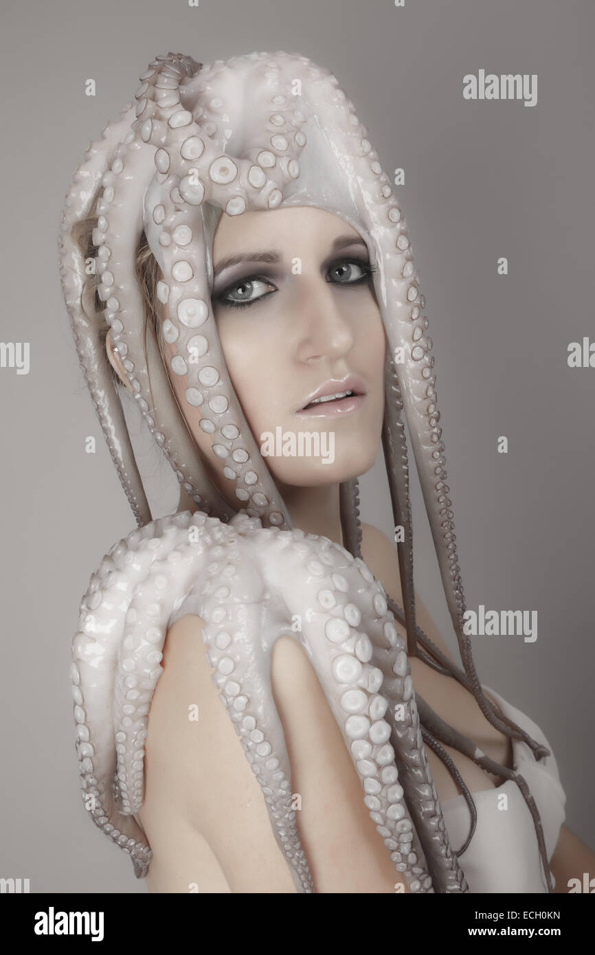 young woman with octopus on head Stock Photo - Alamy