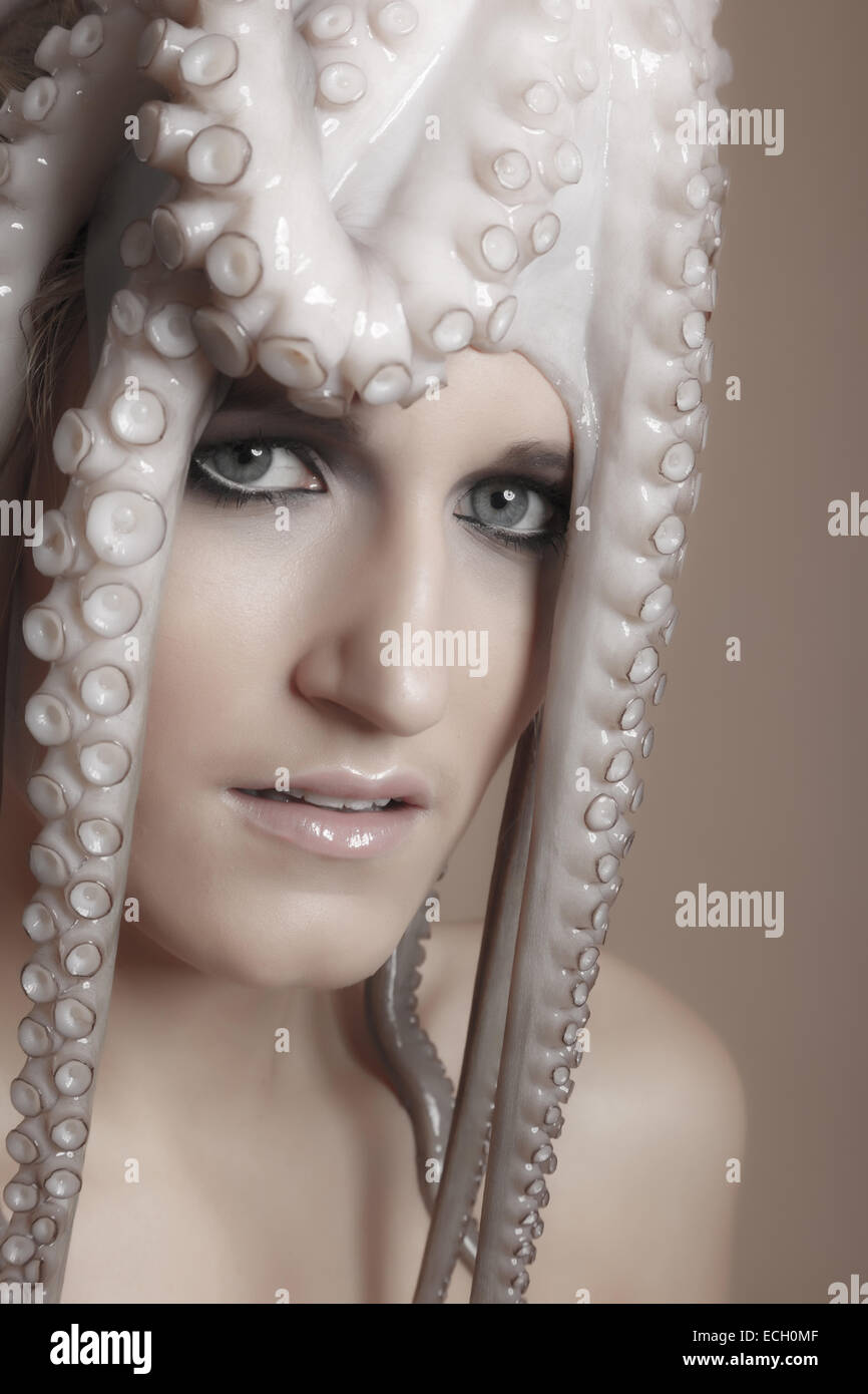 Young woman octopus on head hi-res stock photography and images - Alamy
