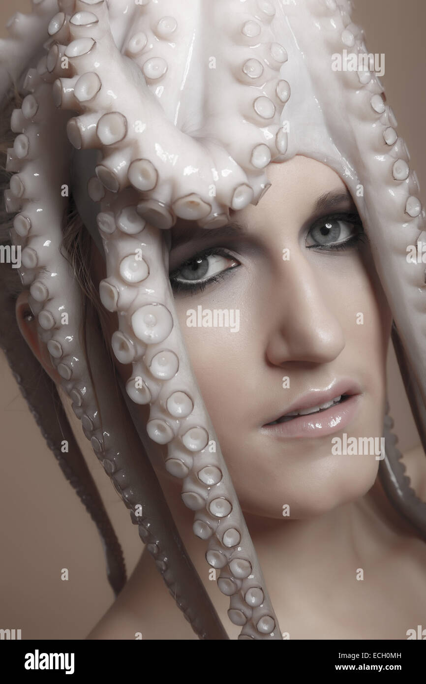 Young woman octopus on head hi-res stock photography and images - Alamy