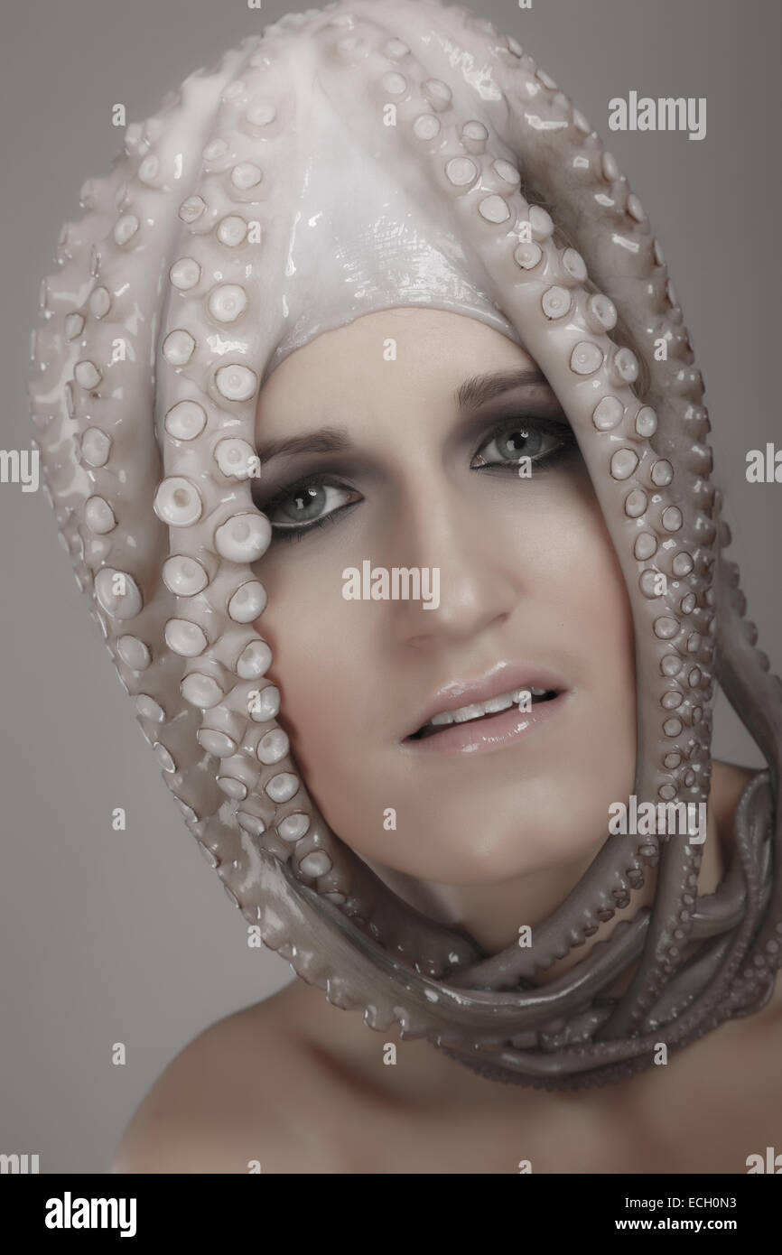 young woman with octopus on head Stock Photo - Alamy