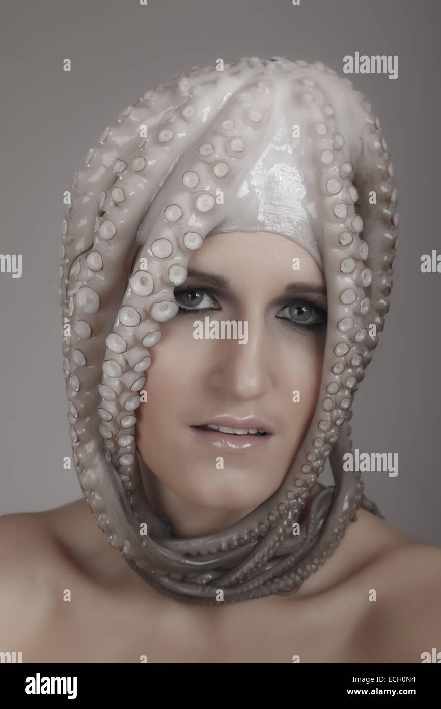 young woman with octopus on head Stock Photo - Alamy