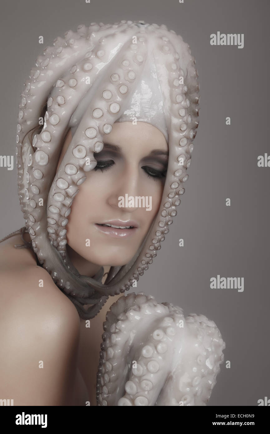 young woman with octopus on head Stock Photo - Alamy