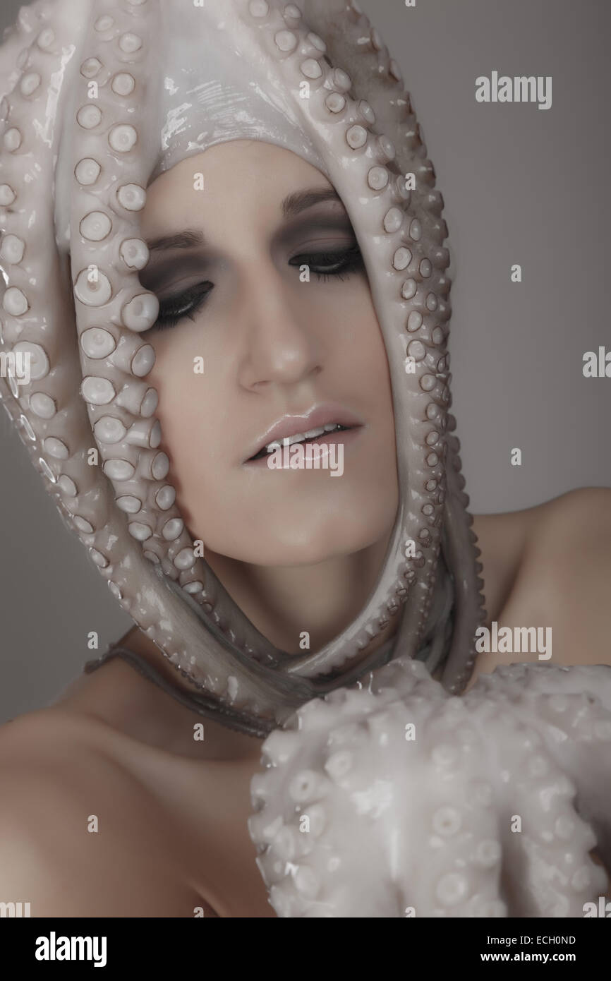 young woman with octopus on head Stock Photo - Alamy
