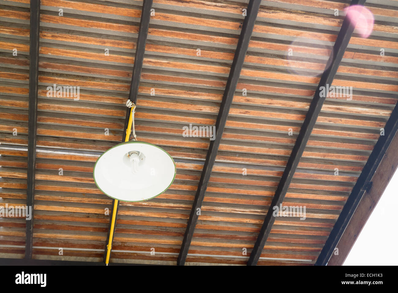 White light bulb hanging from ceiling ceiling hi-res stock photography ...