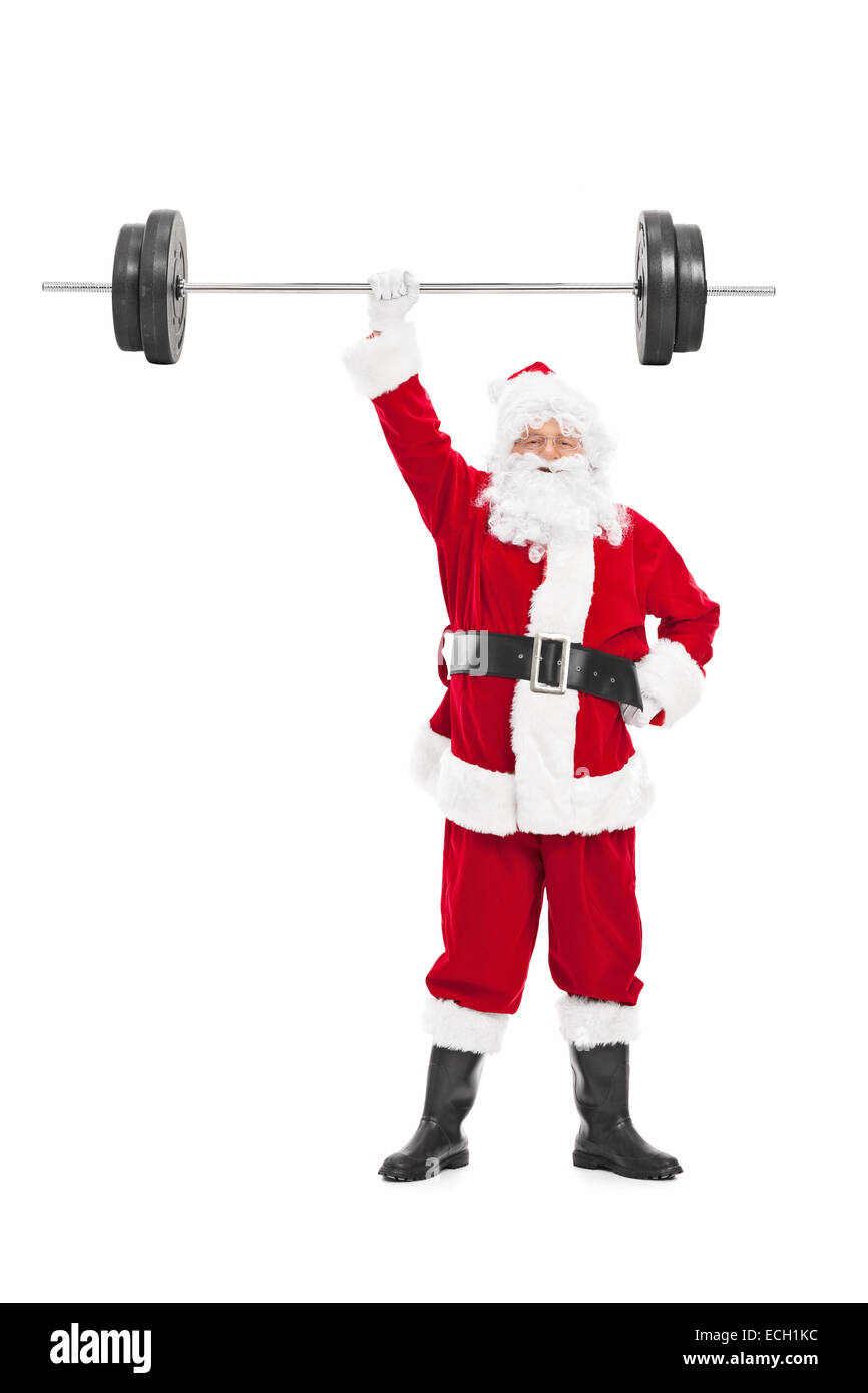 Full length portrait of Santa holding a heavy barbell in one hand ...