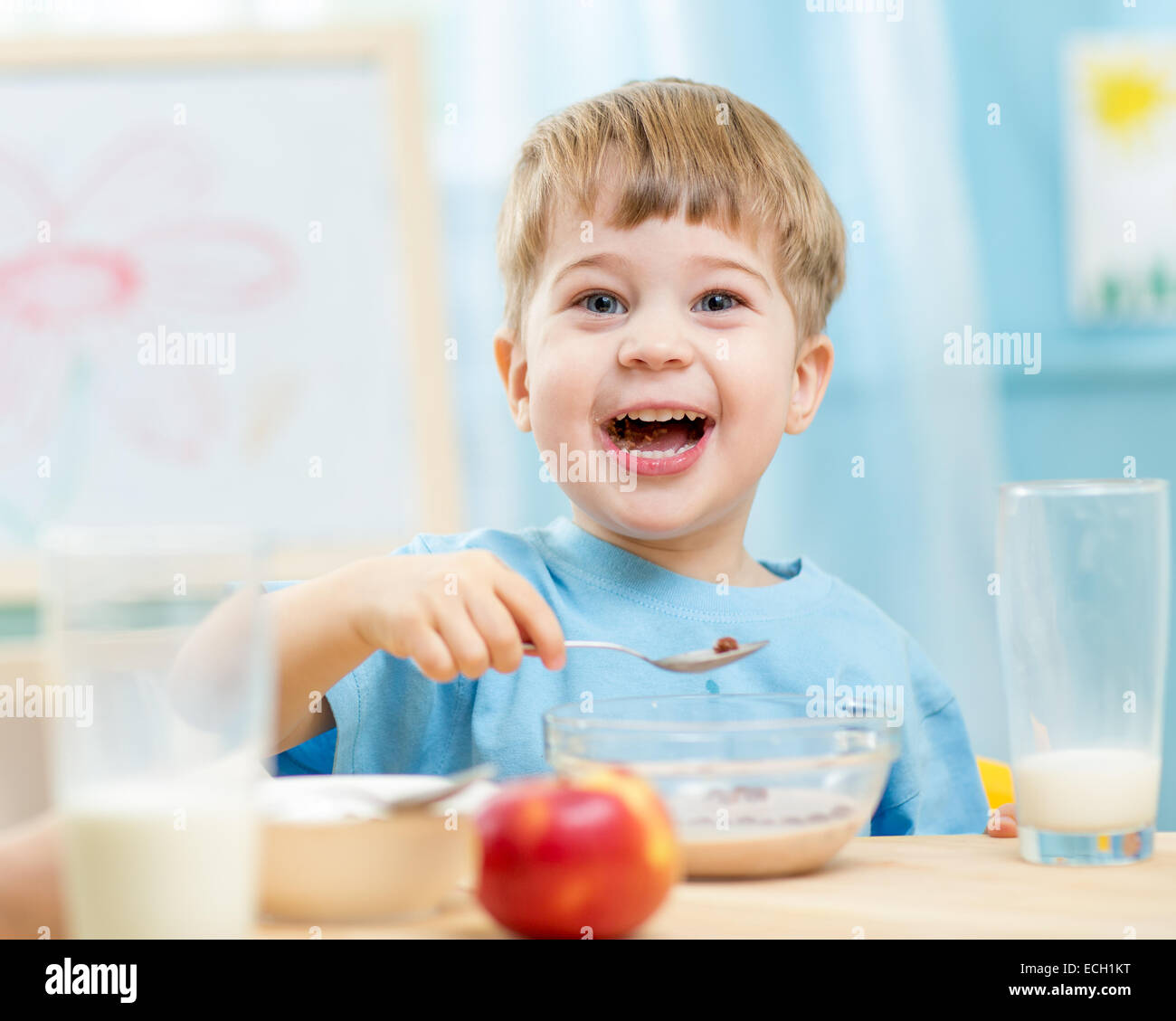 Funny smiling kid eating apple hi-res stock photography and images - Alamy