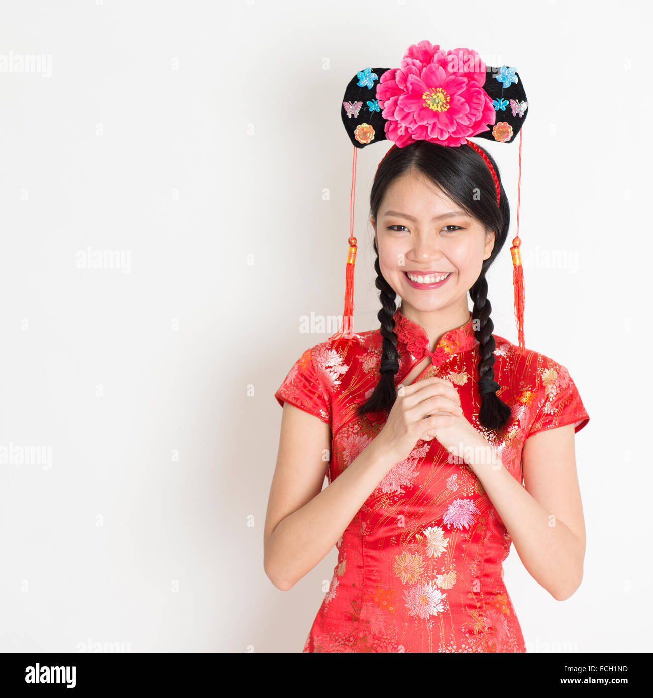 Portrait of Asian Chinese girl with princess hat greeting, in ...