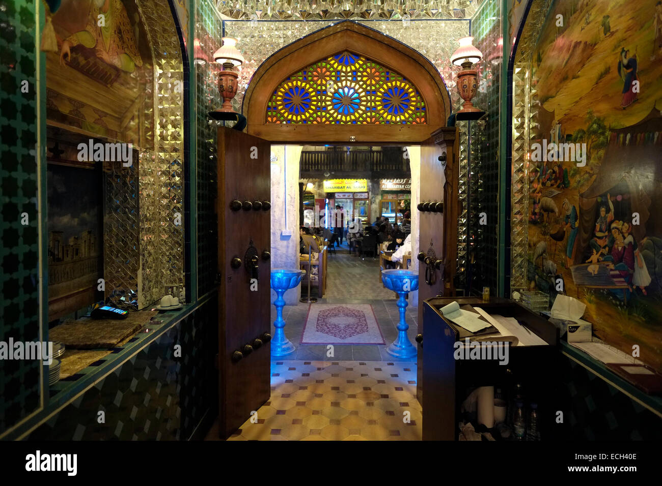 Decorated entrance of the Iranian Parisa restaurant located in Souq ...