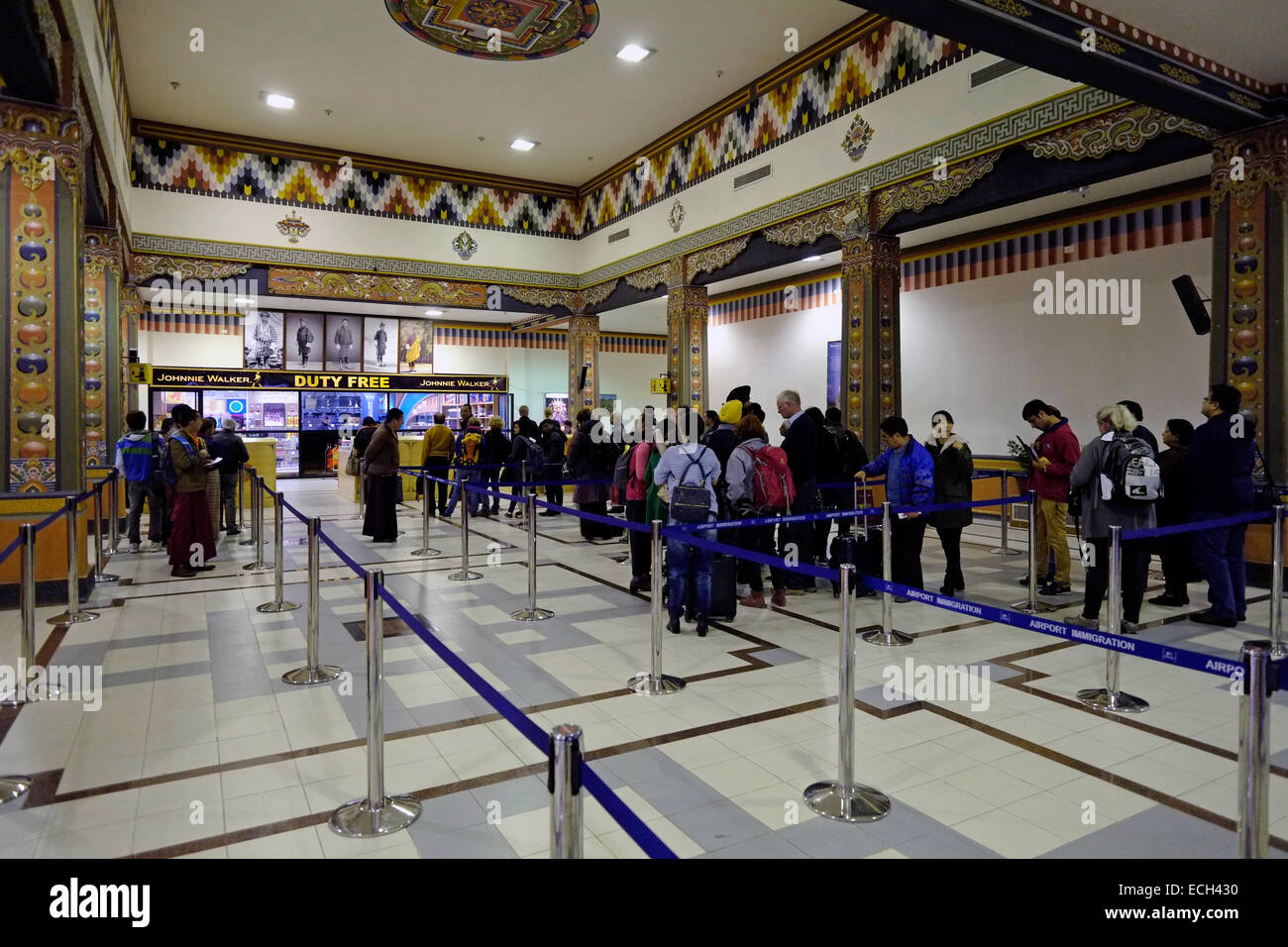 Passengers going through Immigration desks at the arrival hall of the ...
