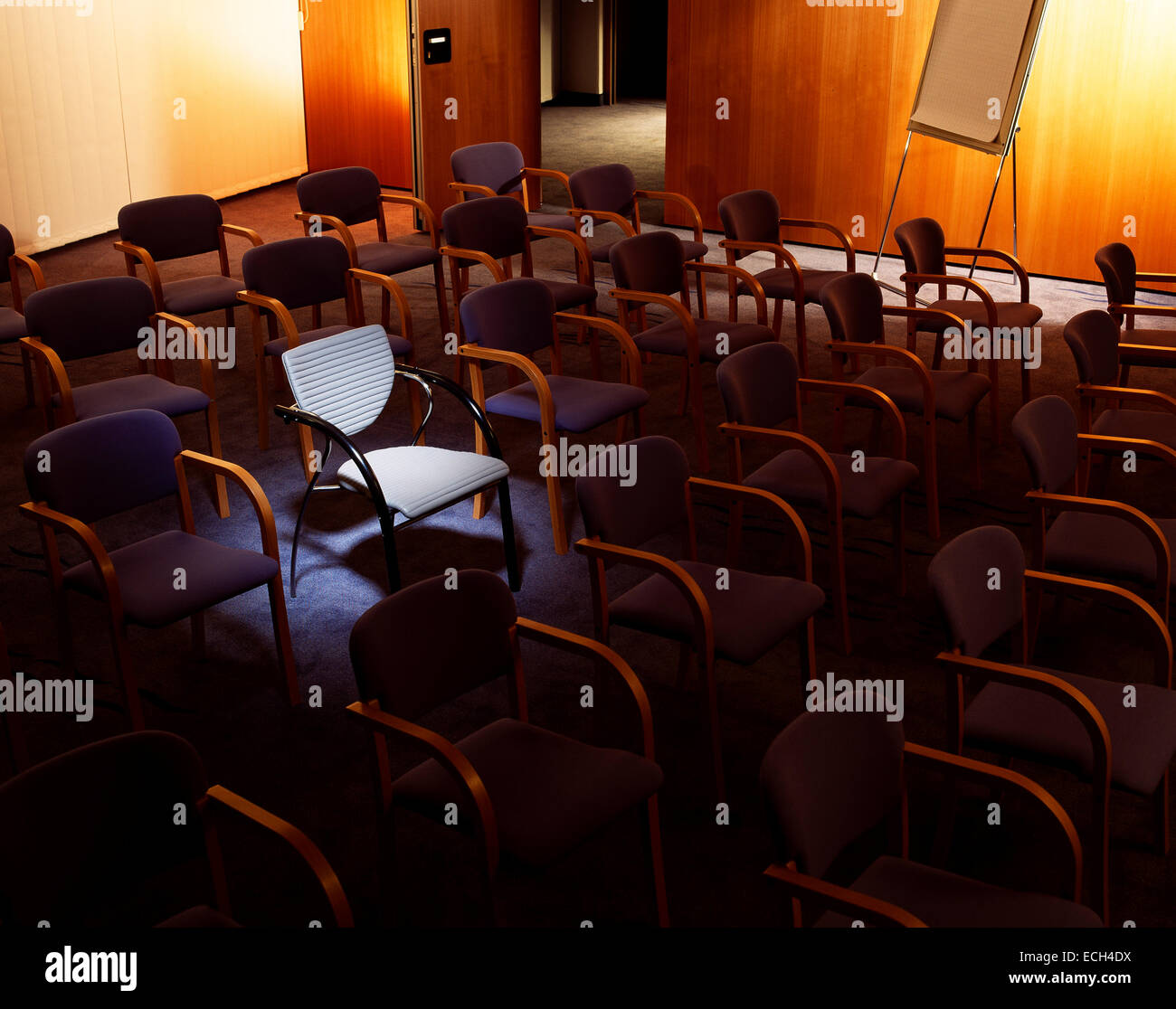 Chairs in a lecture hall, a chair is illuminated Stock Photo - Alamy