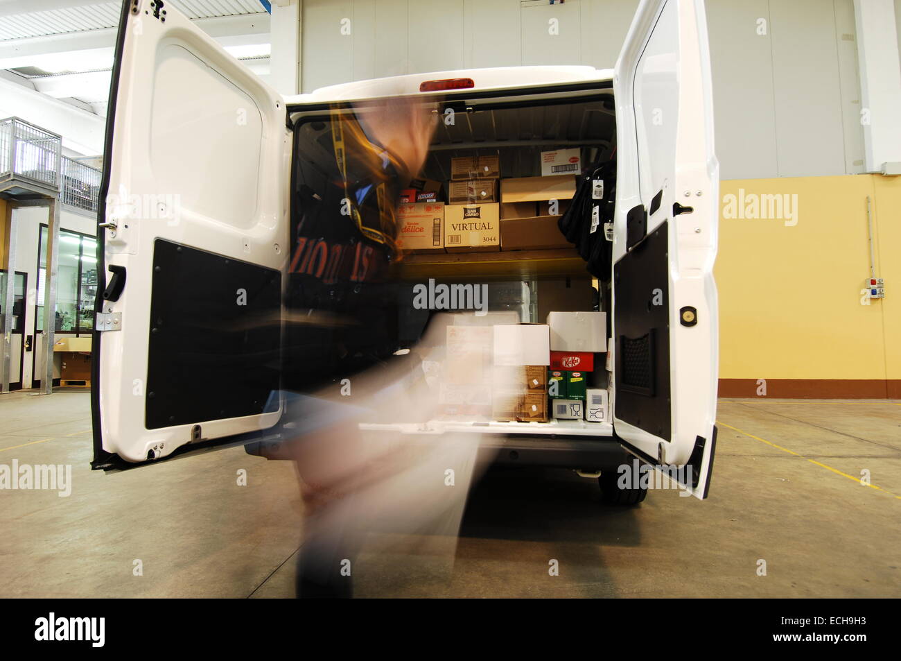Warehouse workers moving boxes from shelf with forklift Stock Photo - Alamy
