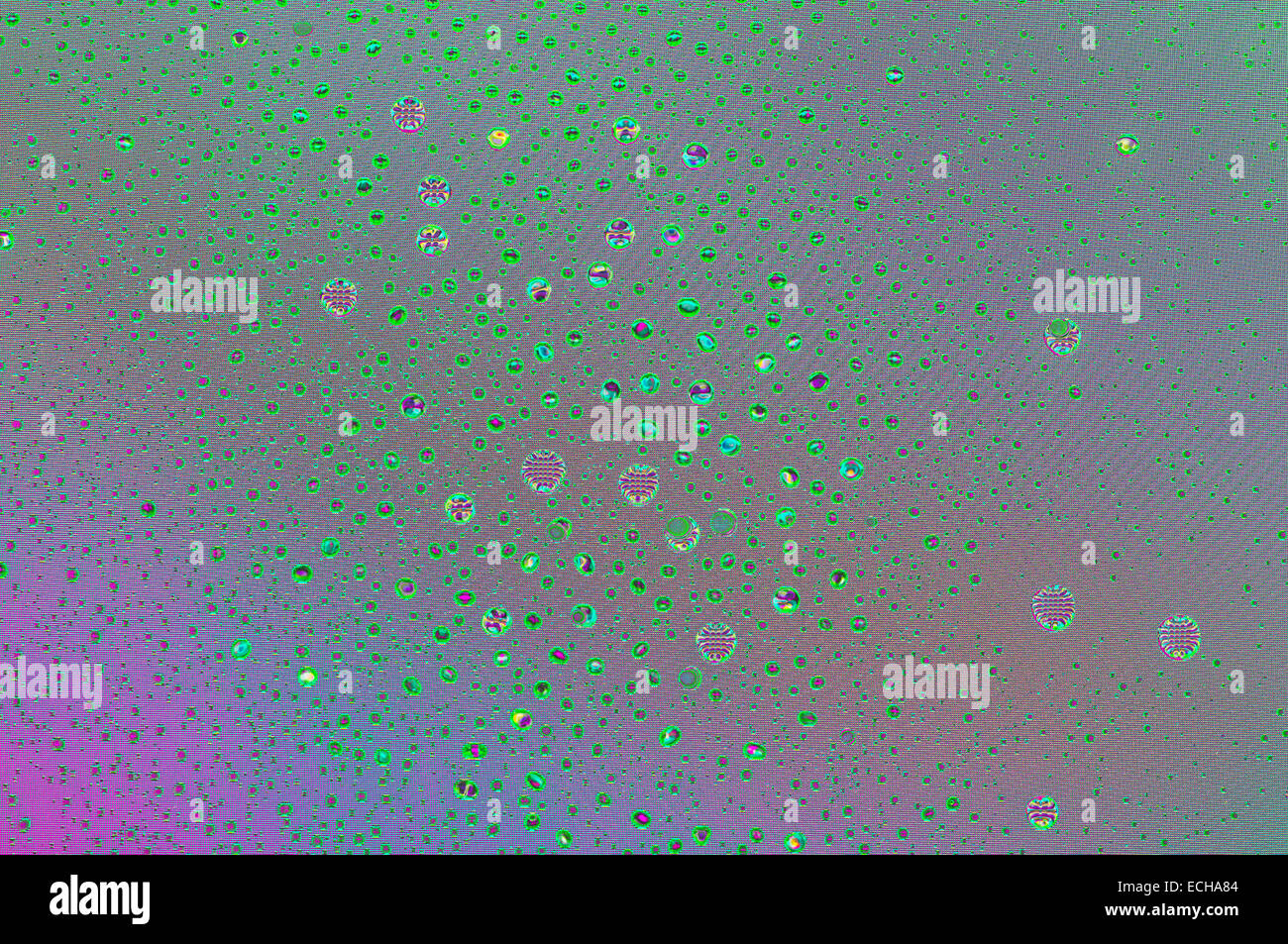 Water droplets on a computer screen. Abstract patterns an be useful for ...