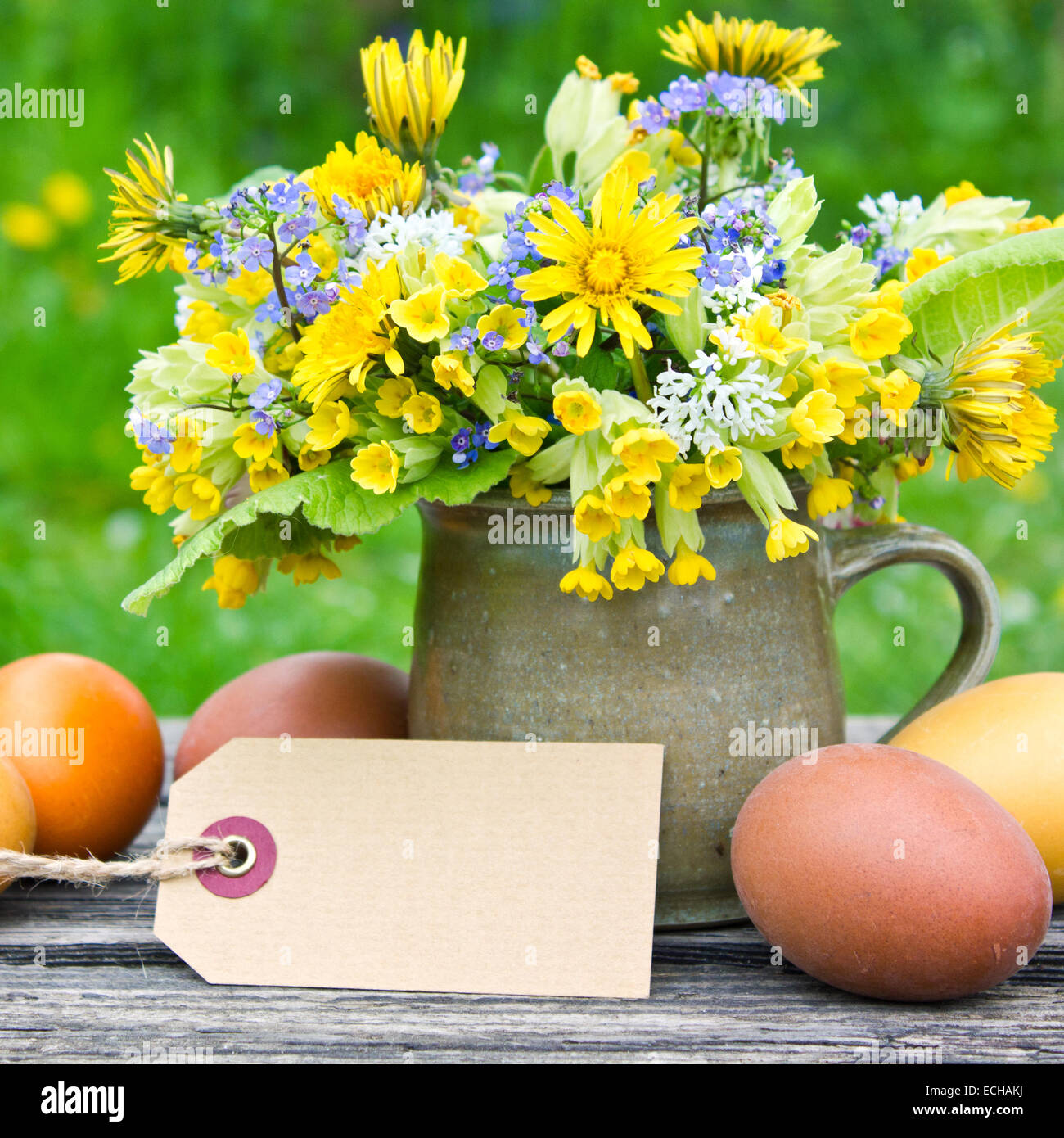 Bouquet with spring flowers easter eggs and label Stock Photo - Alamy