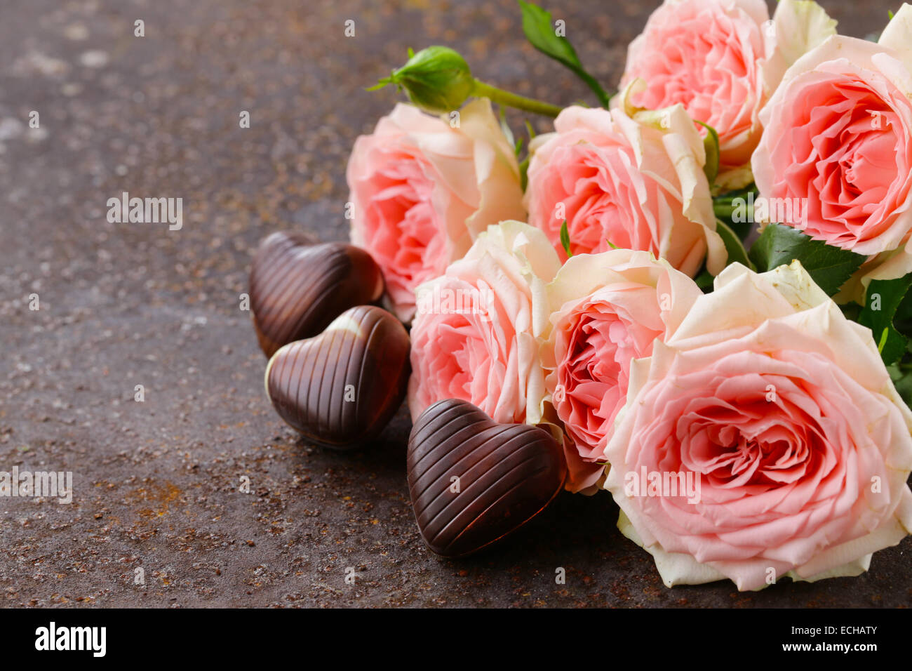 chocolate candy hearts and pink roses for Valentine's day holiday Stock ...