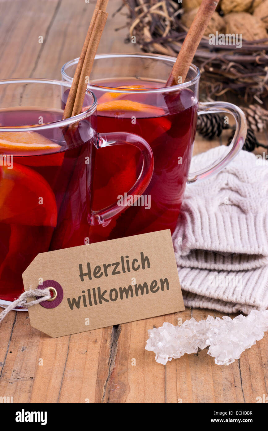 Fruit tea with orange and card with lettering welcome Stock Photo - Alamy