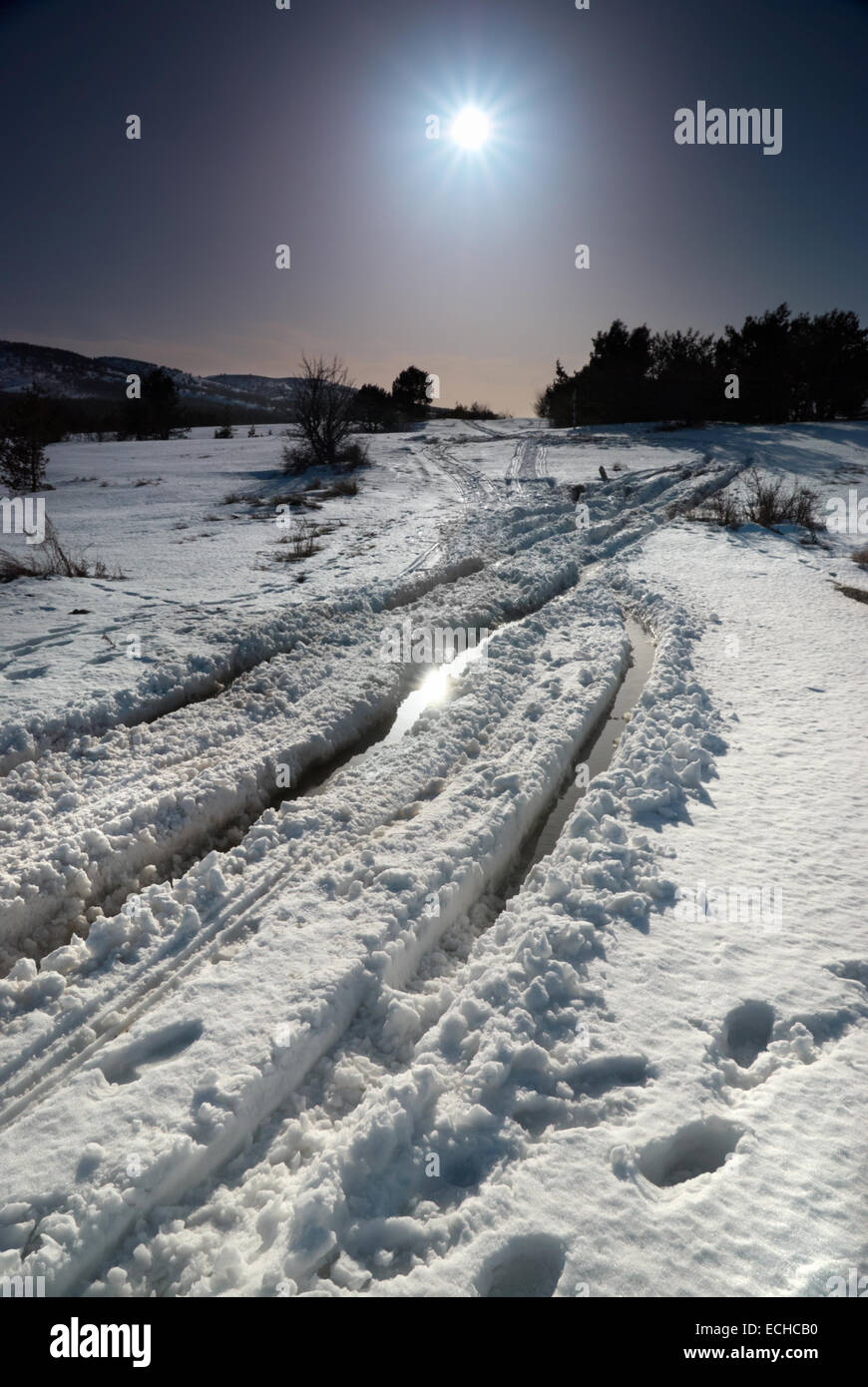 Winter snow road with sunshine star Stock Photo - Alamy