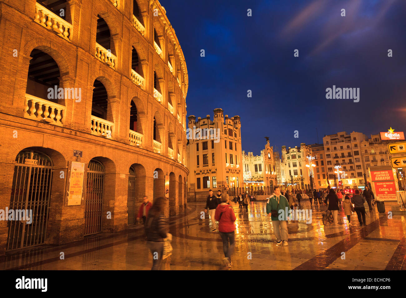 Exterior of the Bullring Plaza de Toros Valencia lit up on a wet rainy ...