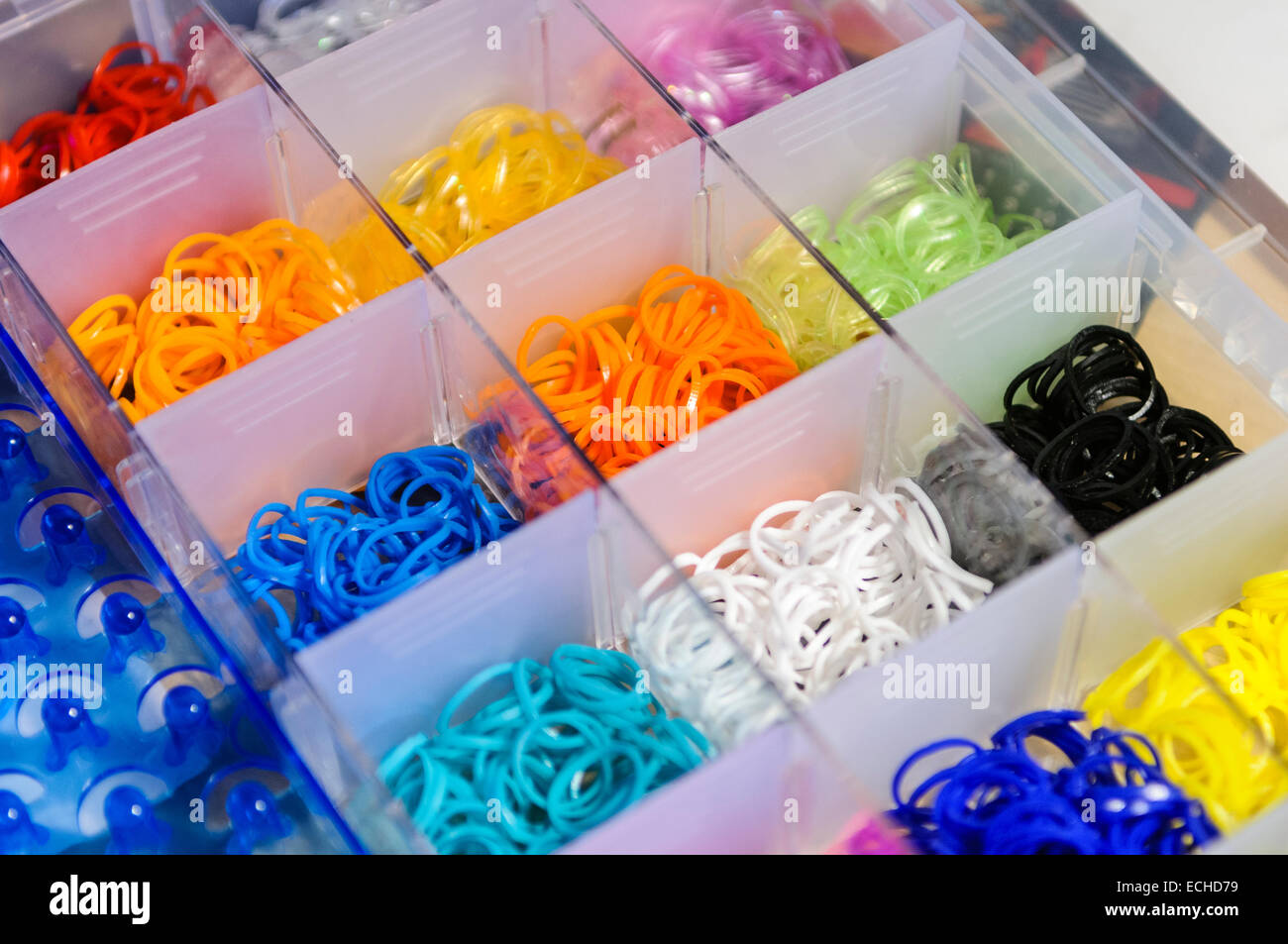Colourful loom bands in a plastic box Stock Photo - Alamy