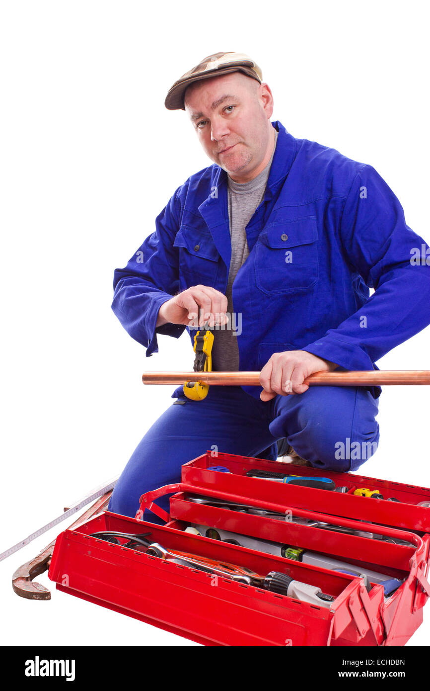 A plumber cutting copper tubing Stock Photo - Alamy