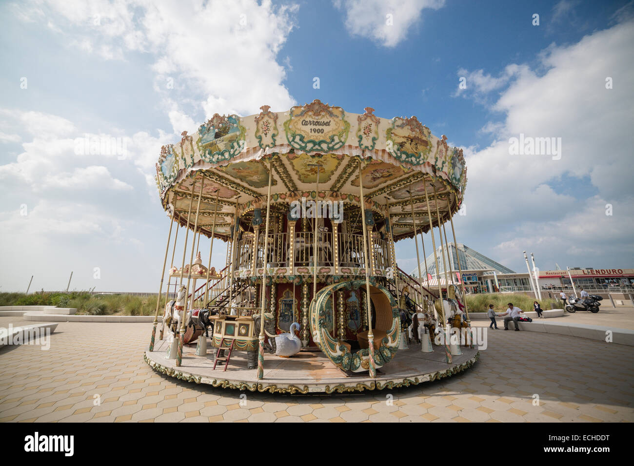 A traditional carousel or merry-go-round at a French seaside holiday ...