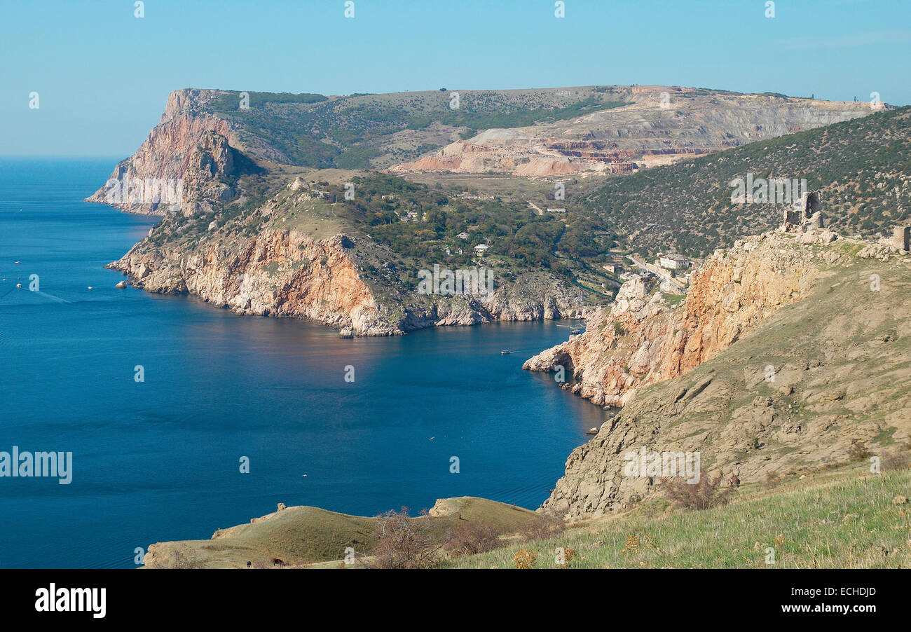 Sea landscape with rocks and tower Stock Photo - Alamy