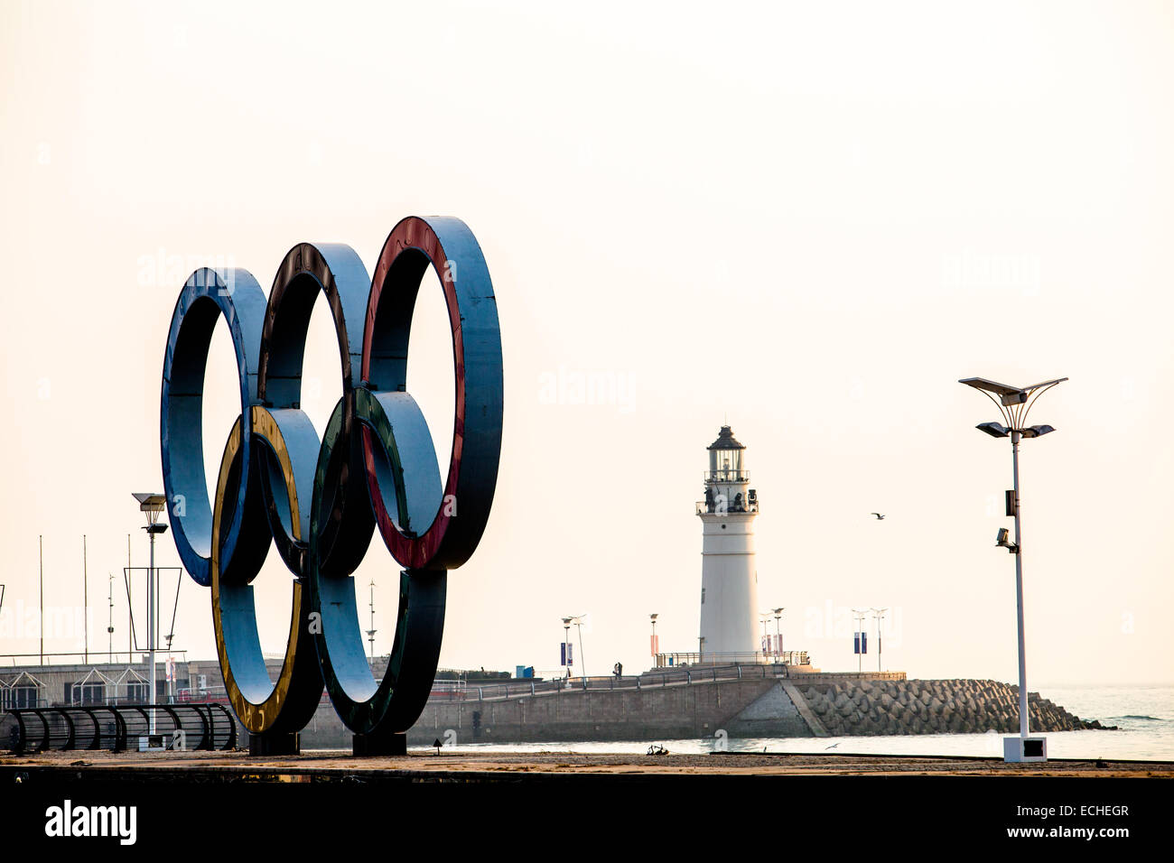 Olympic ring and lighthouse in Qingdao Olympic sailing center Stock ...