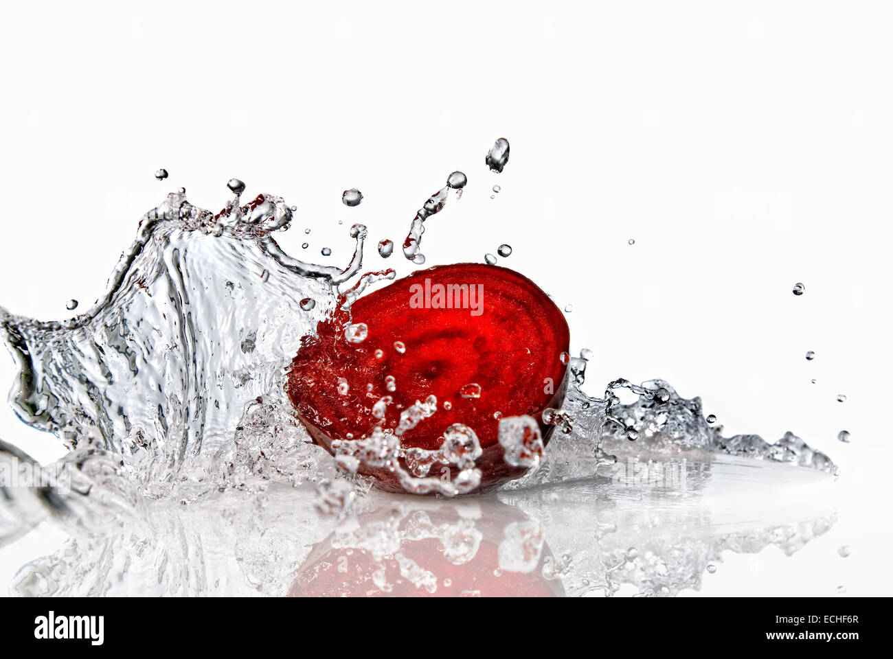 red beet with water splash isolated on white Stock Photo - Alamy