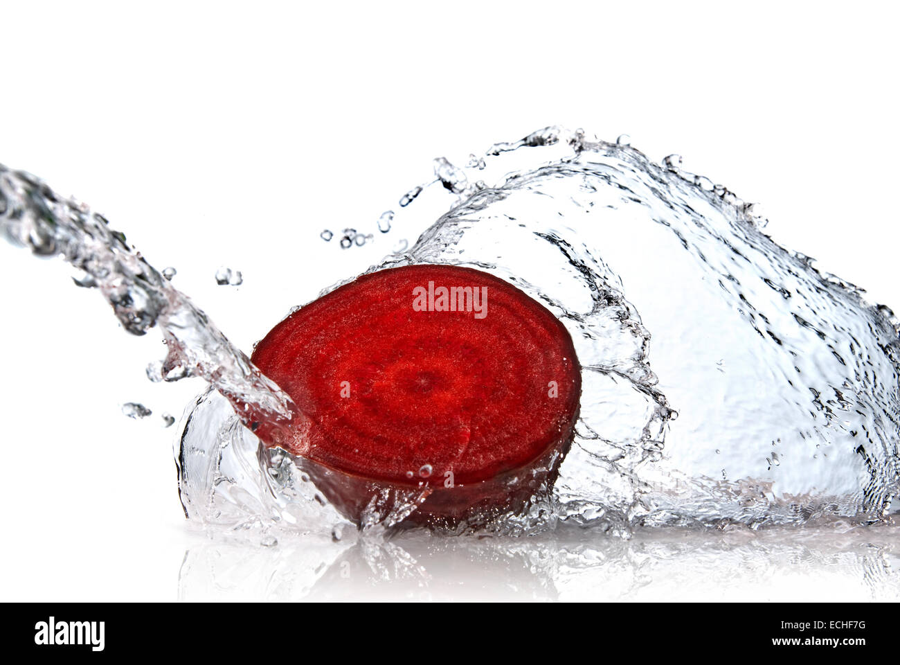 red beet with water splash isolated on white Stock Photo - Alamy