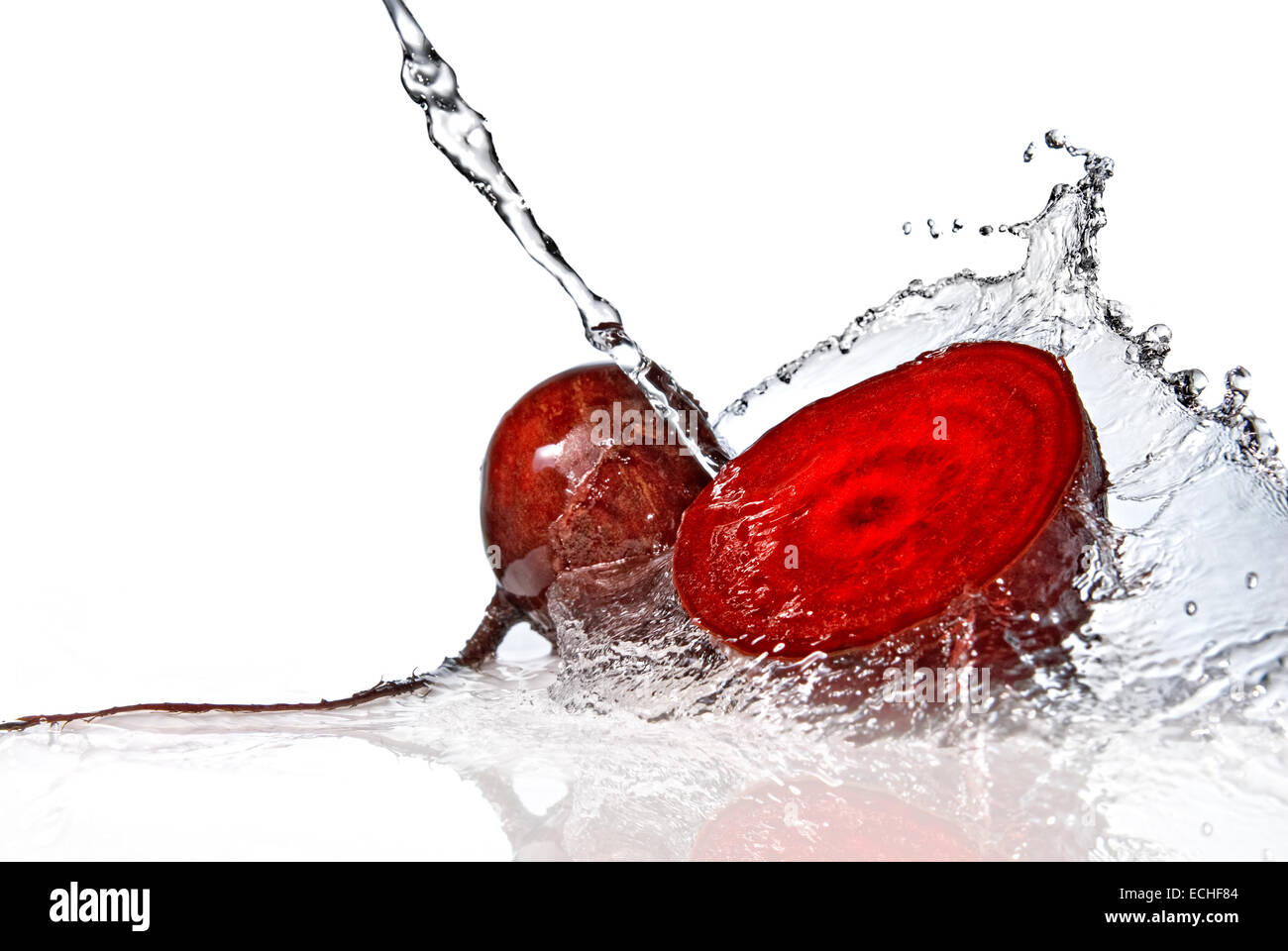 red beet with water splash isolated on white Stock Photo - Alamy