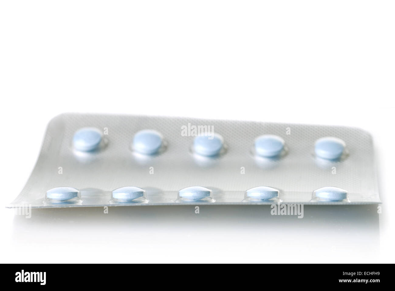 pack of blue tablets isolated on white Stock Photo - Alamy