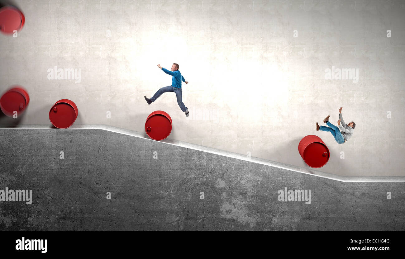 rolling barrell game and running people Stock Photo - Alamy